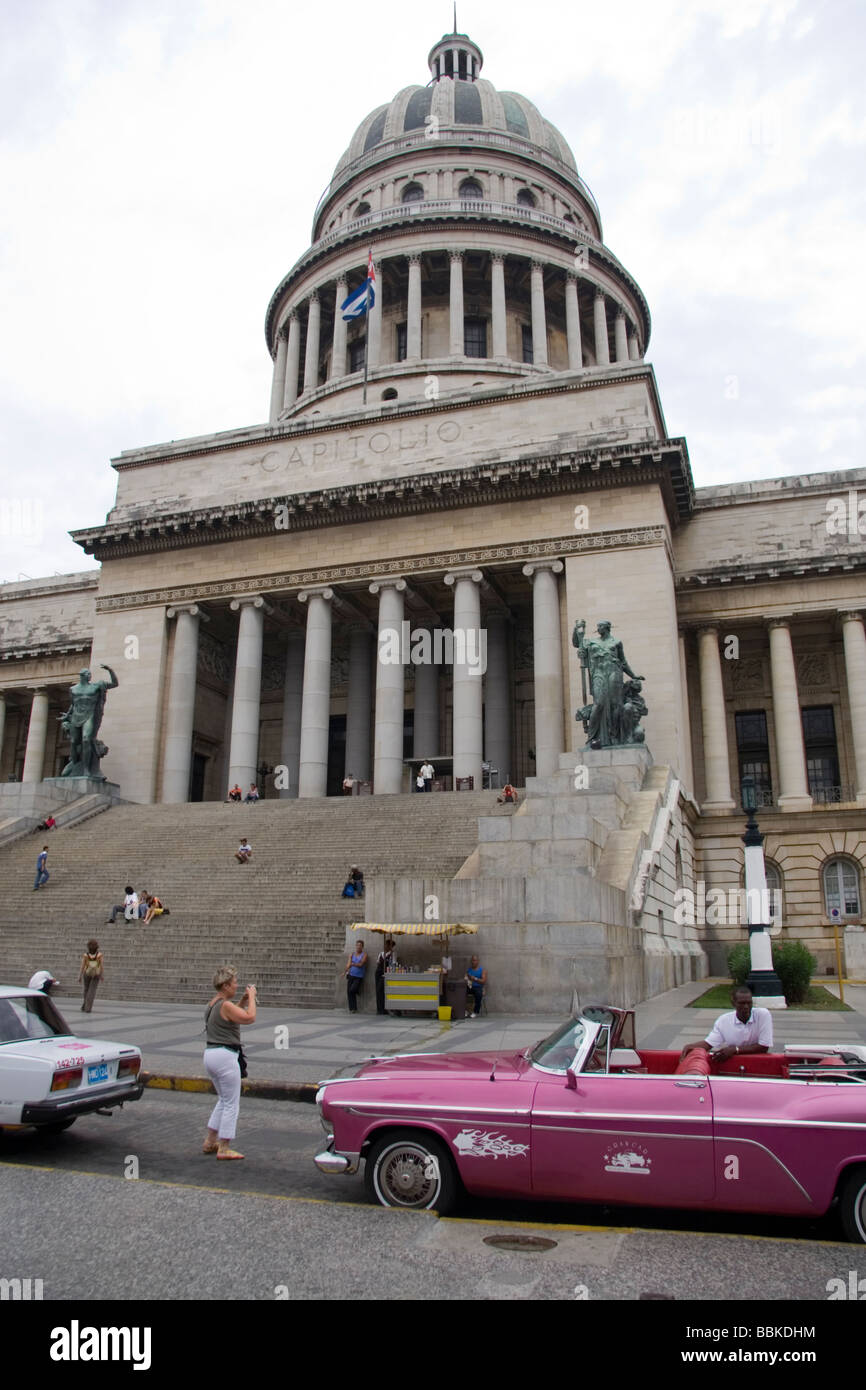 People sitting on the steps of the National Capitol Building Havana ...