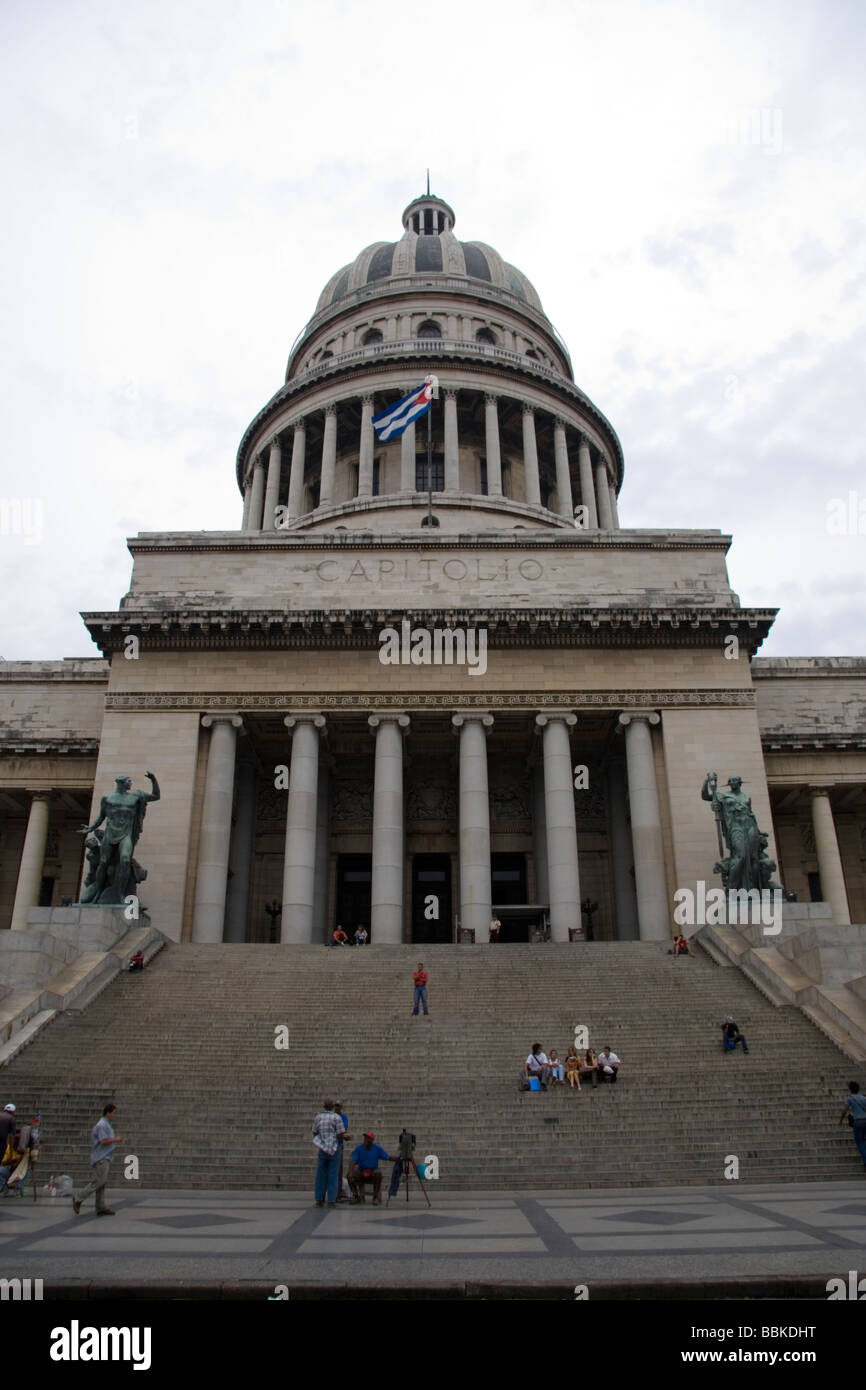 People sitting on the steps of the National Capitol Building Havana ...