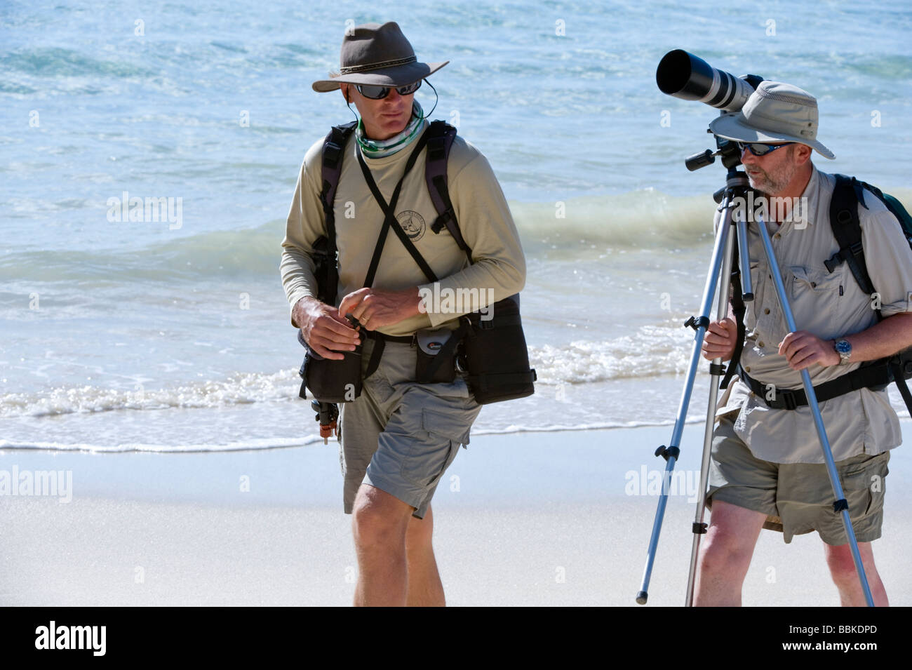 Daniel Fitter and David Hosking walking Flamingo Lagoon Punta Cormoran ...