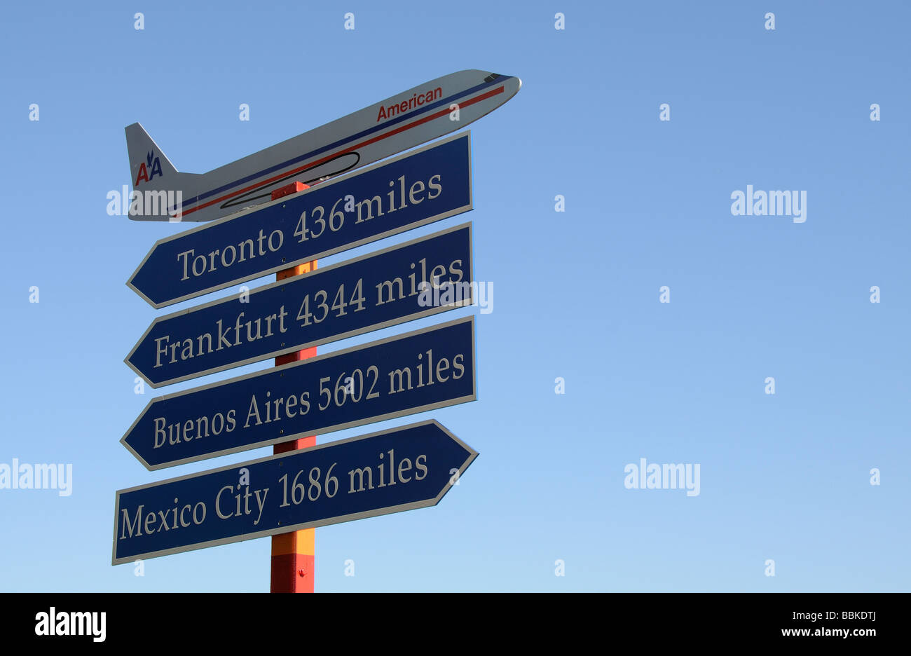 American Airlines jet plane and worldwide destinations signpost Stock ...