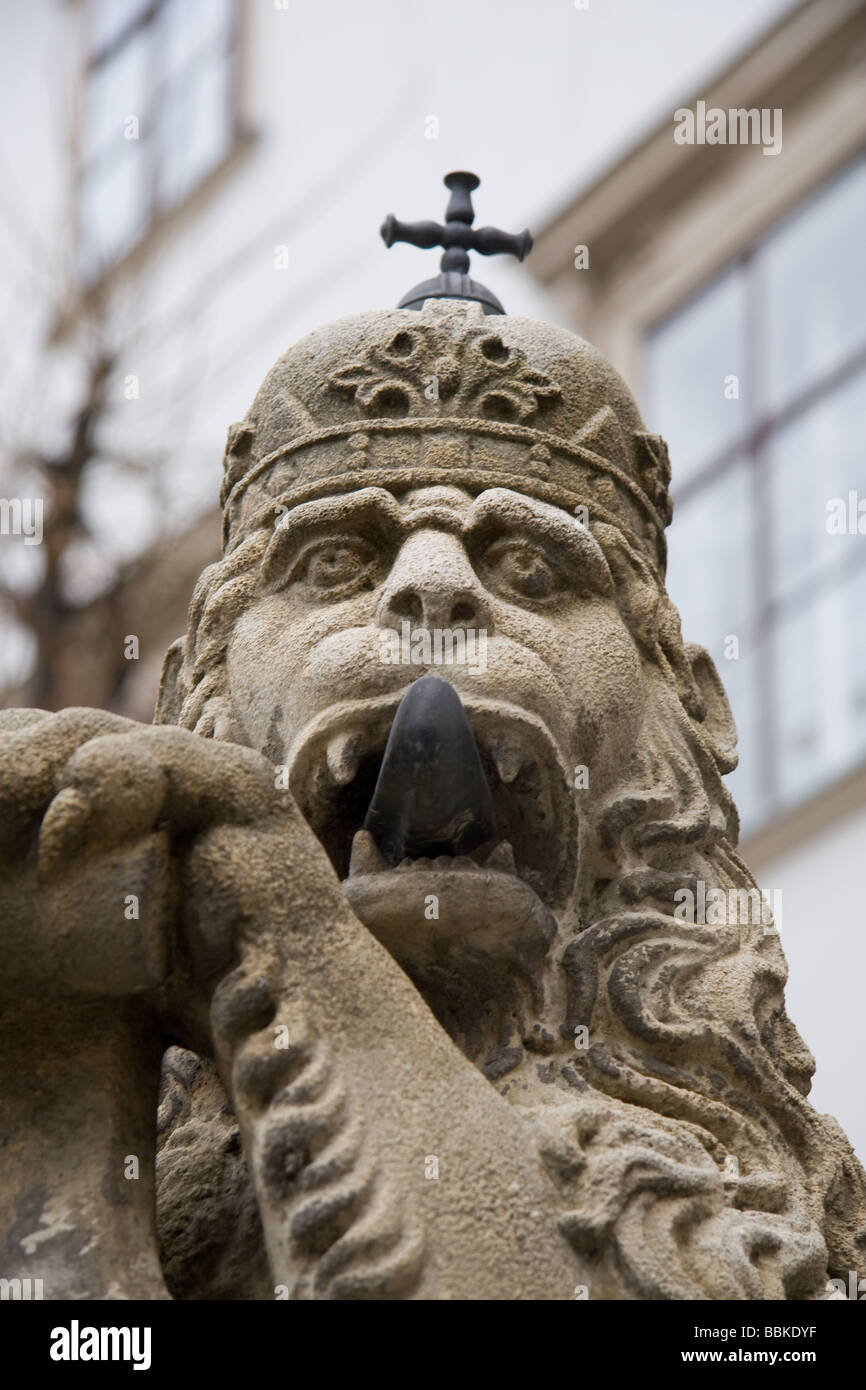 Stone statue with tongue pointing out, Vienna, Austria near Spanish ...