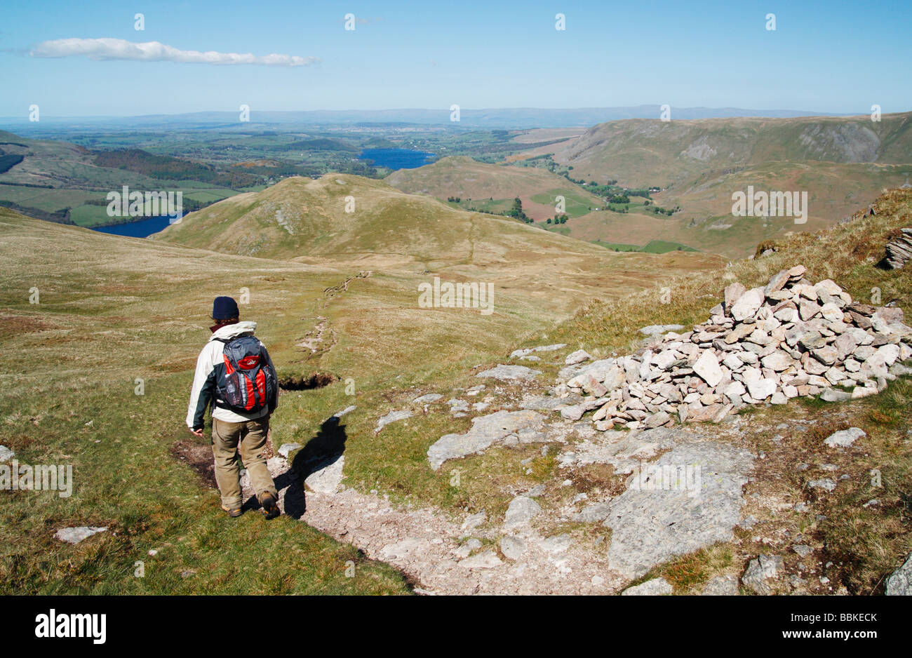 Female hiker on the descent to Ullswater from summit of Place Fell ...