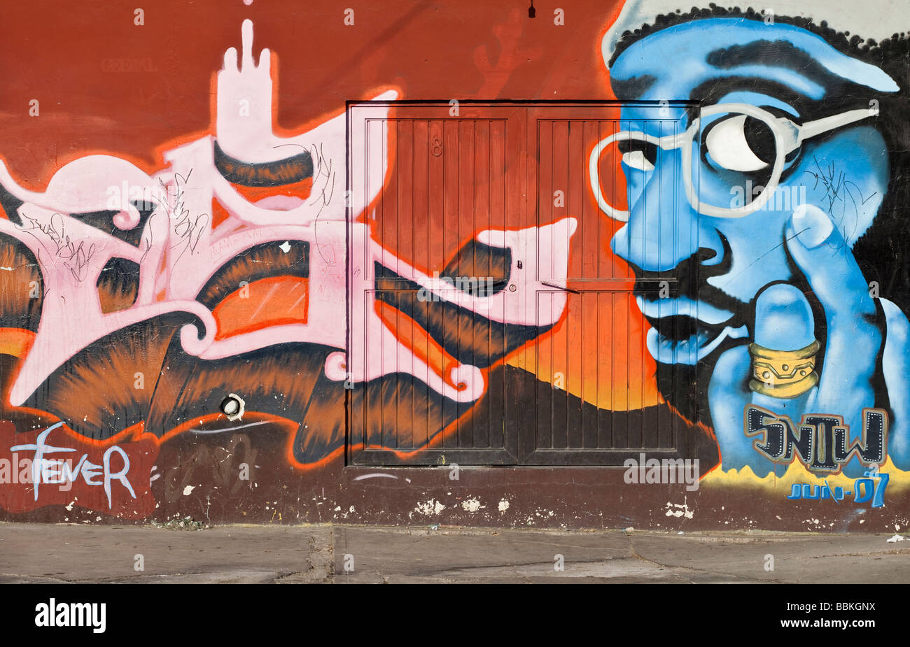 Wall mural showing a Mexican man thinking along a street in the Spanish ...