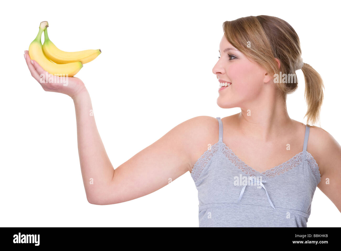 Full isolated portrait of a beautiful caucasian woman with some bananas ...