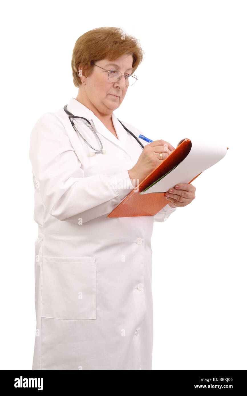 Senior female family doctor taking notes on notepad over white ...