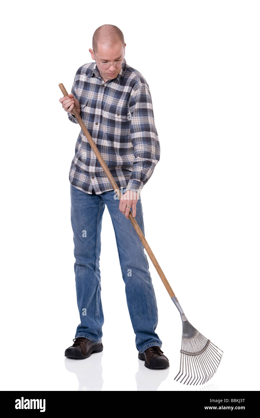 Full isolated studio picture from a young gardener with a rake Stock ...