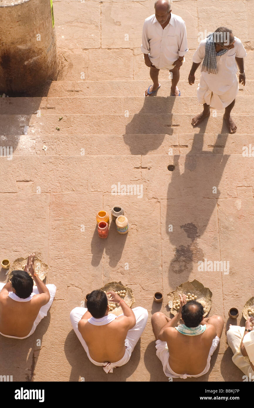Brahmins doing their job - performing a religious ritual (preparing ...