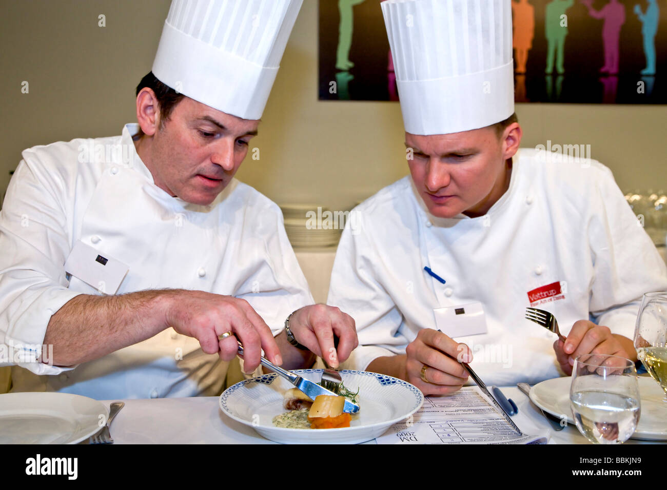 Two referees tasting food at cooking championship Stock Photo - Alamy
