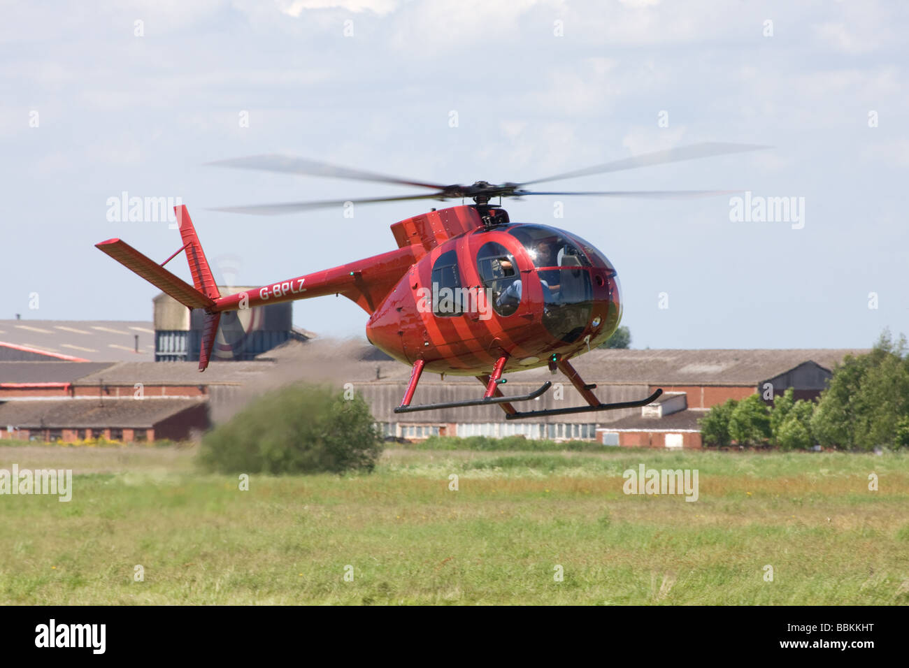 Hughes 369HS 500 G-BPLZ in flight hovering at Sandtoft Airfield Stock ...