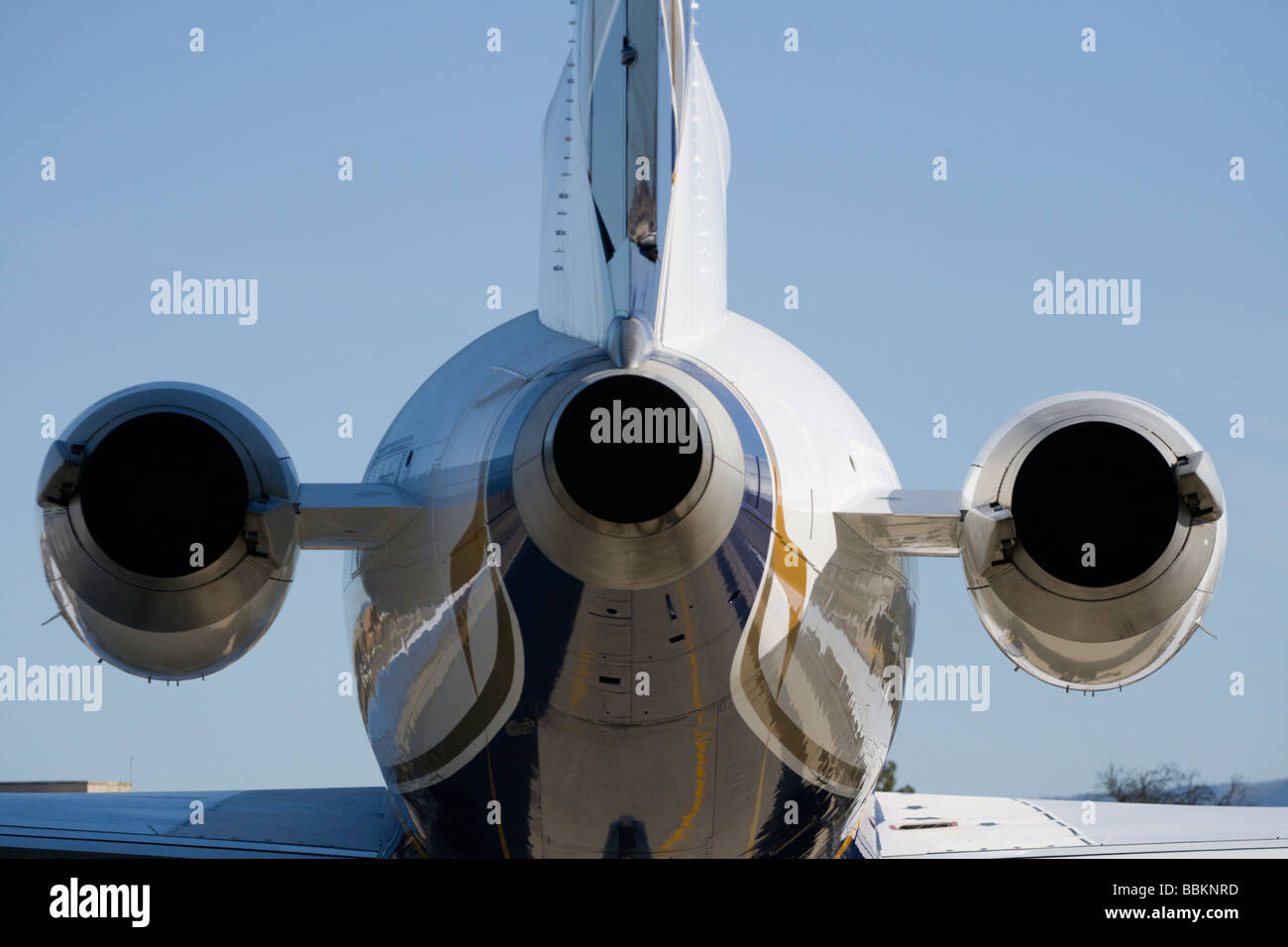 Rear view of a three-engine jet liner Stock Photo - Alamy