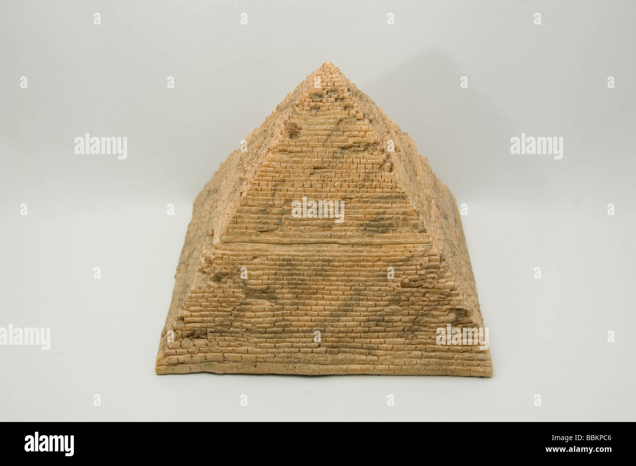 Toy pyramid photographed against a white background Stock Photo - Alamy
