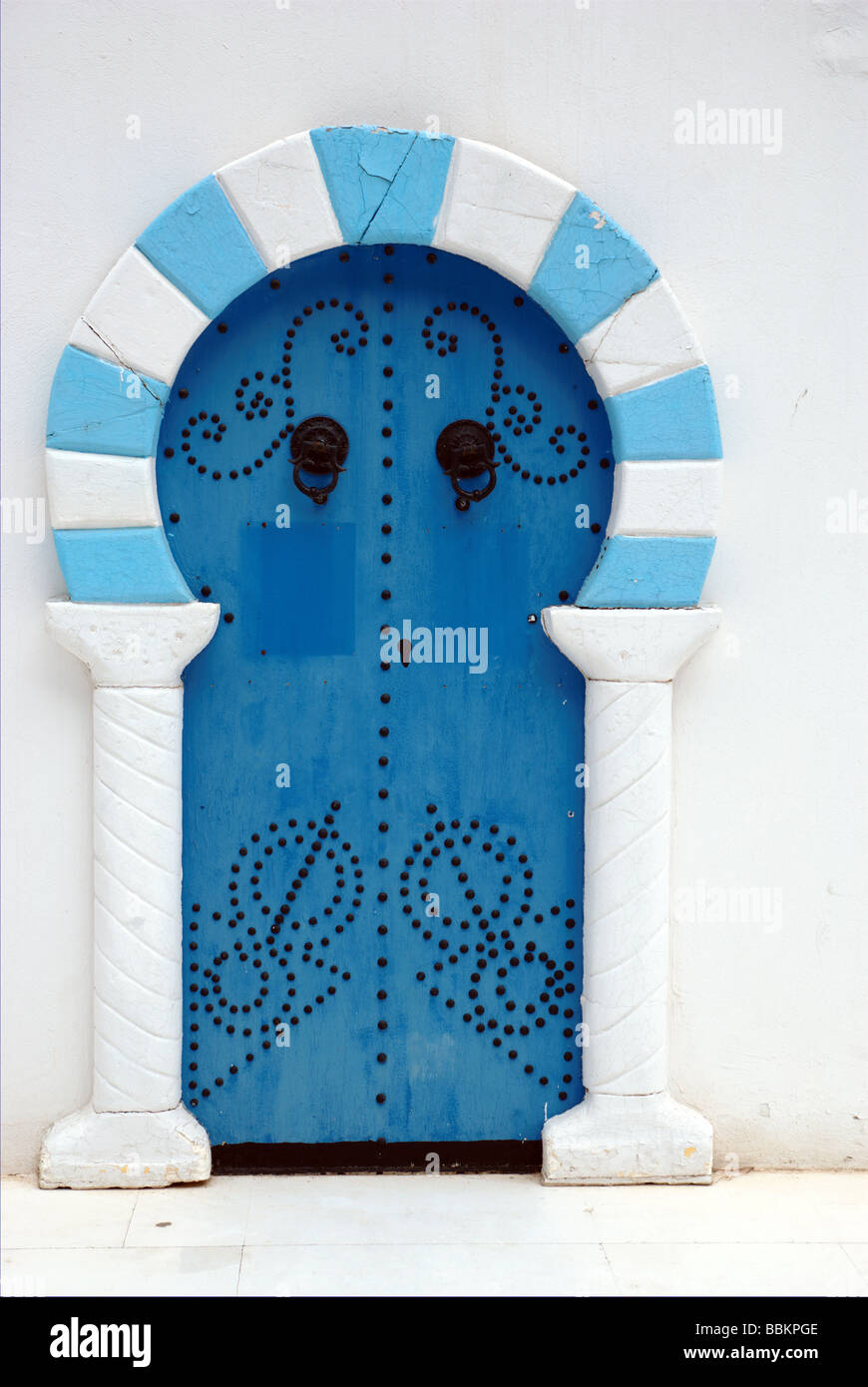 Traditional decorated carved and painted keyhole shaped door in Tunisia ...