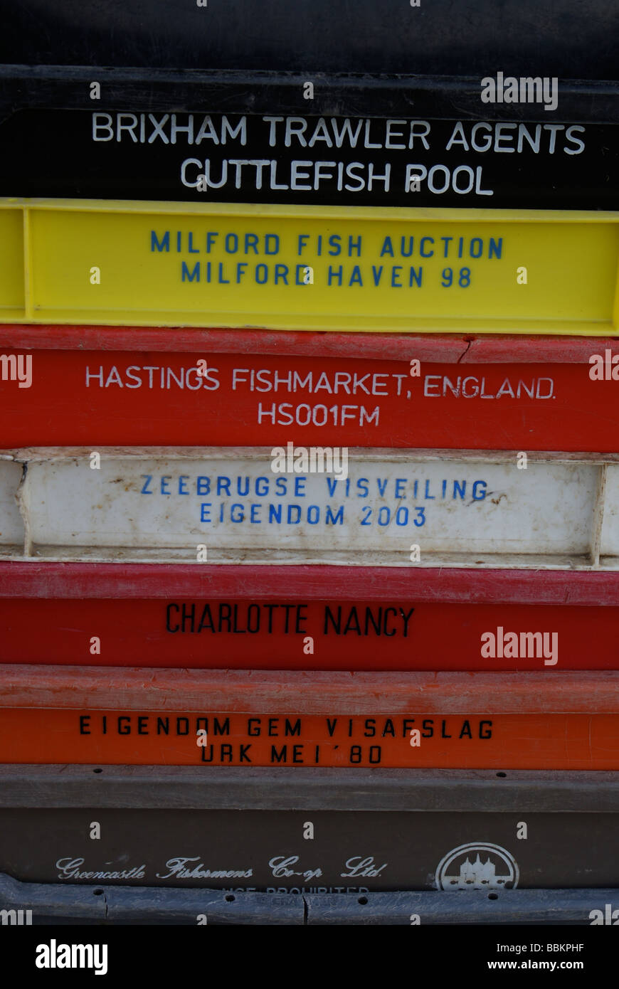 Stacked fish boxes, Quayside, New Quay Harbour, Cardigan Bay, West ...