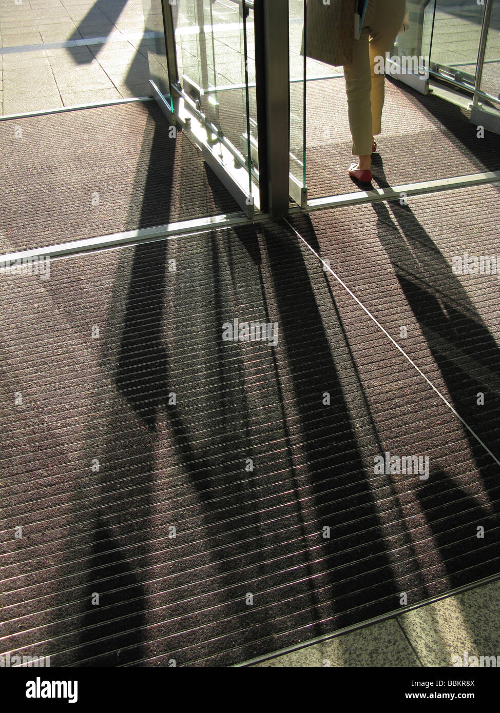 graphic,long shadows,entance to a building.in portrait Stock Photo - Alamy