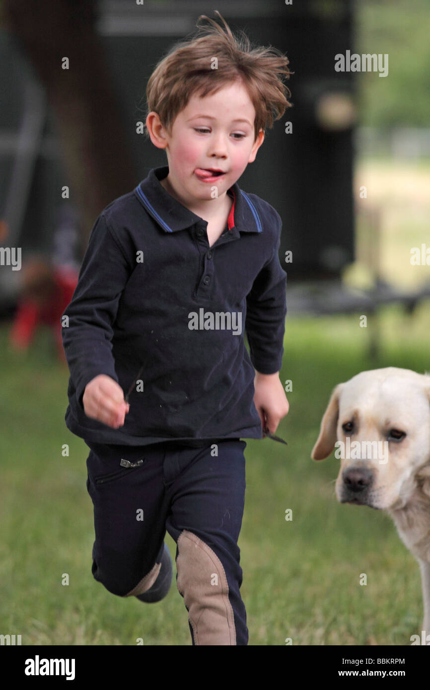 Boy with stick running hi-res stock photography and images - Alamy
