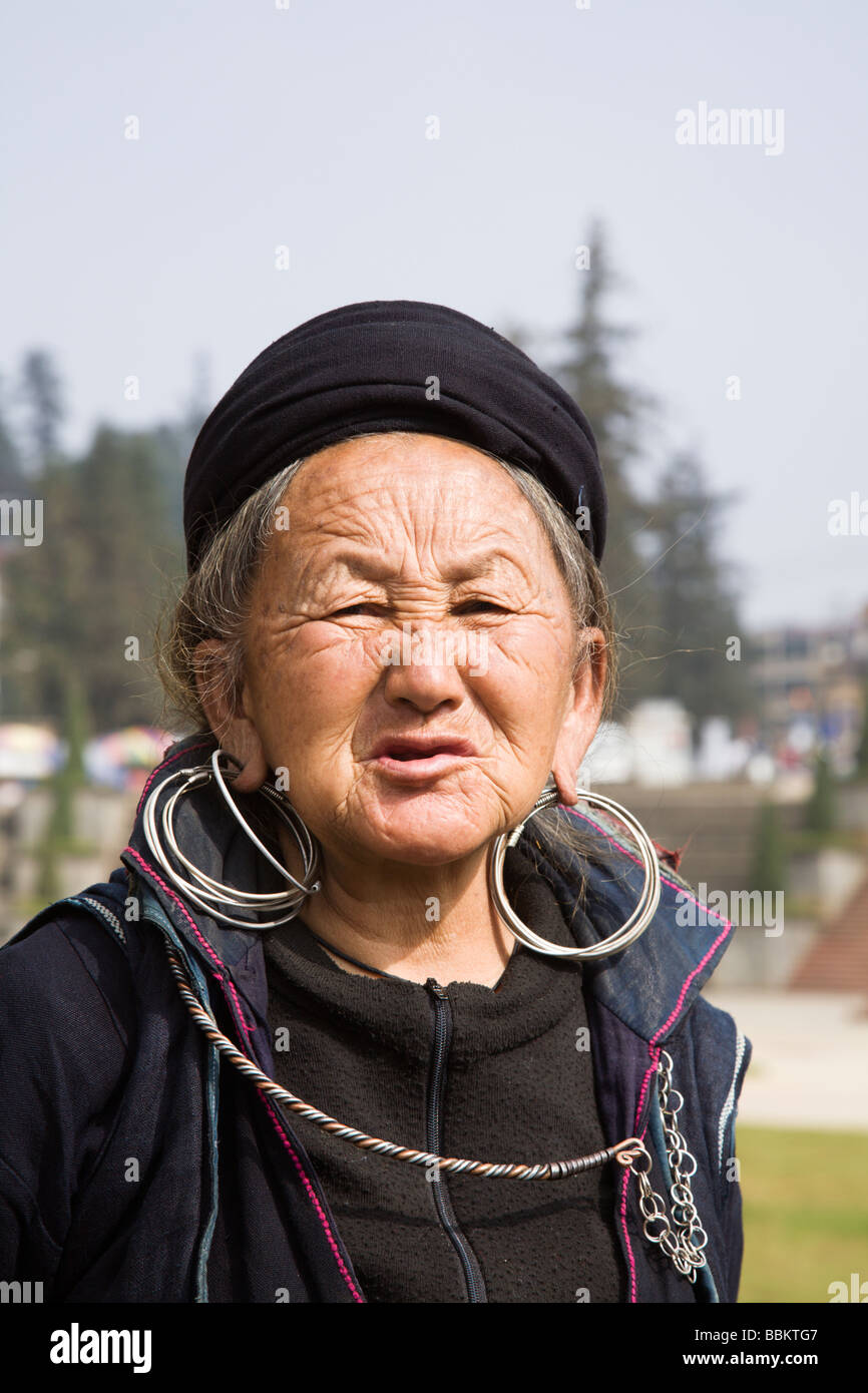 Old Black Hmong woman with big earrings at Sapa town square in North ...