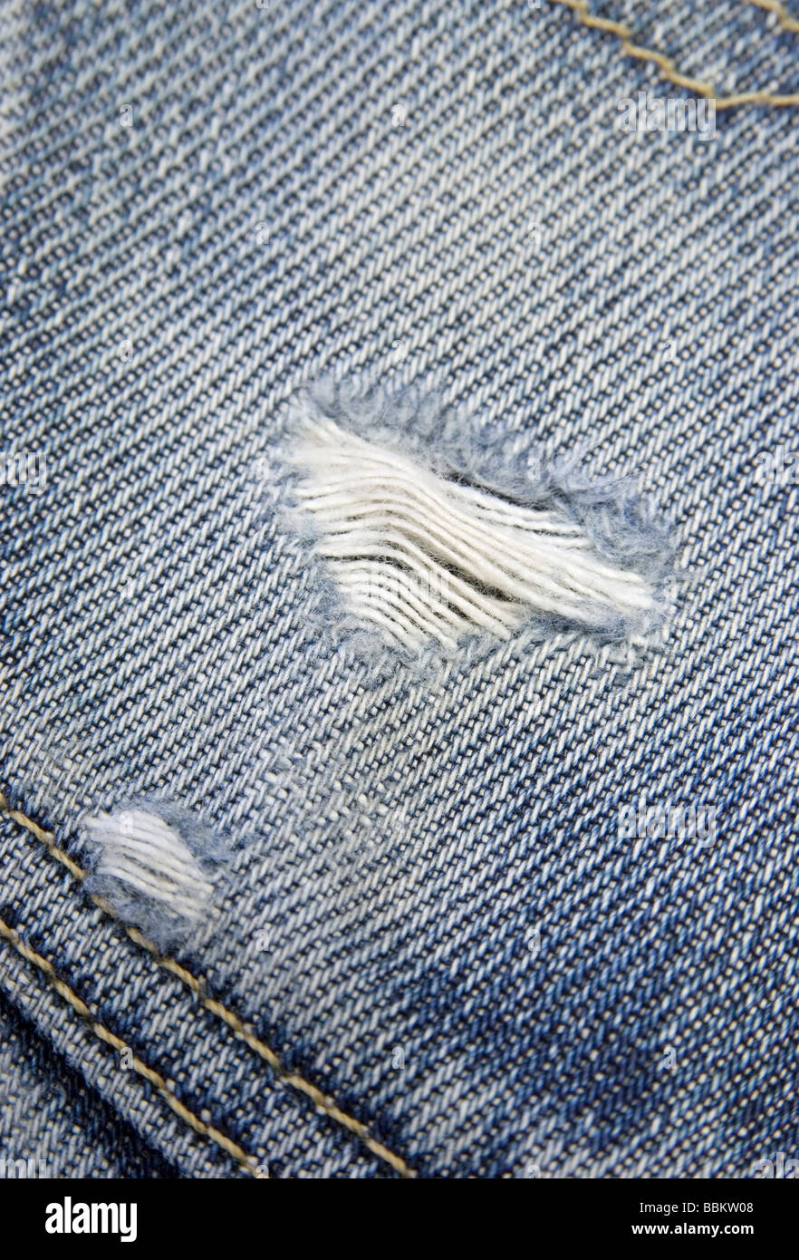Close up of torn denim Stock Photo - Alamy