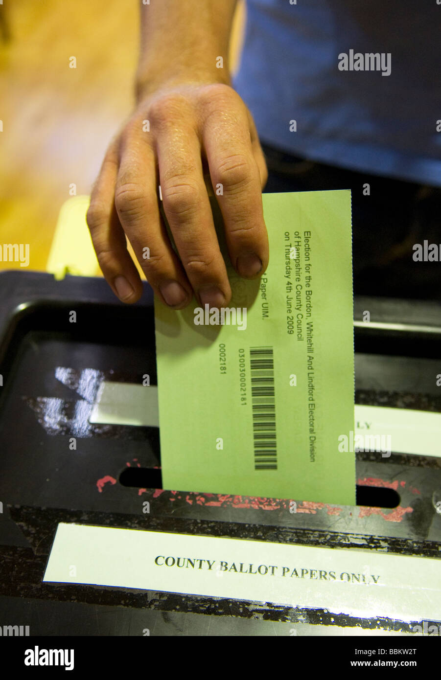 Man casting his vote in June 2009 Council elections, Bordon, Hants UK ...