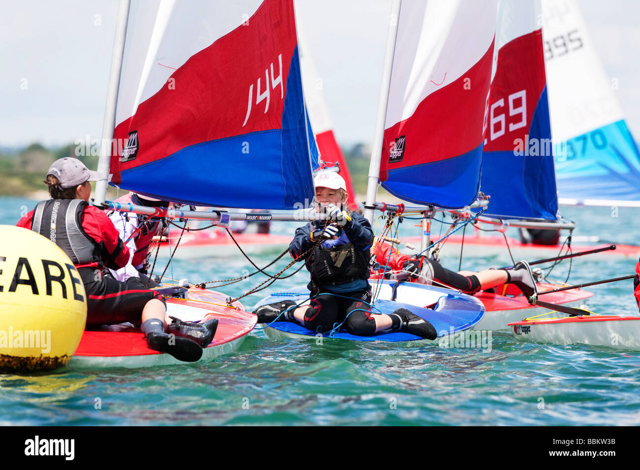 kids racing topper dinghies in chichester harbour uk Stock Photo - Alamy