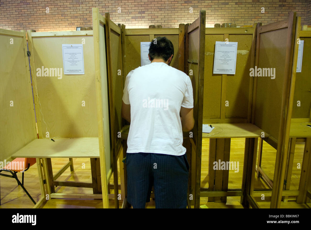 Man casting his vote at Local and European elections, Bordon, Hants, UK ...