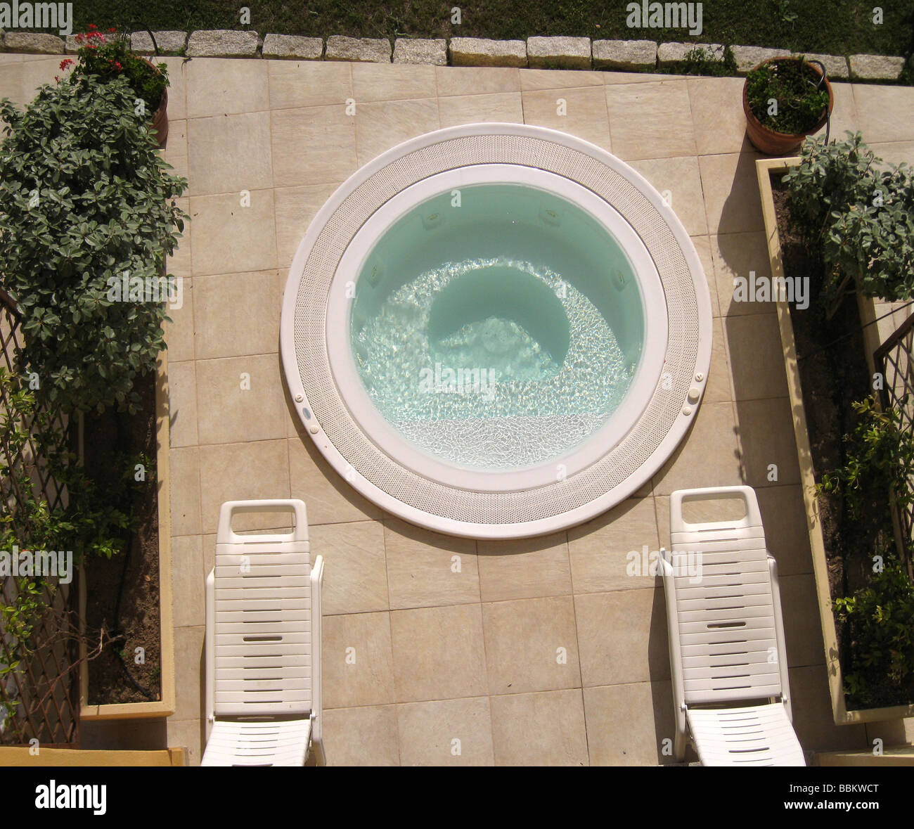 JACUZZI pool and sunbeds Stock Photo - Alamy