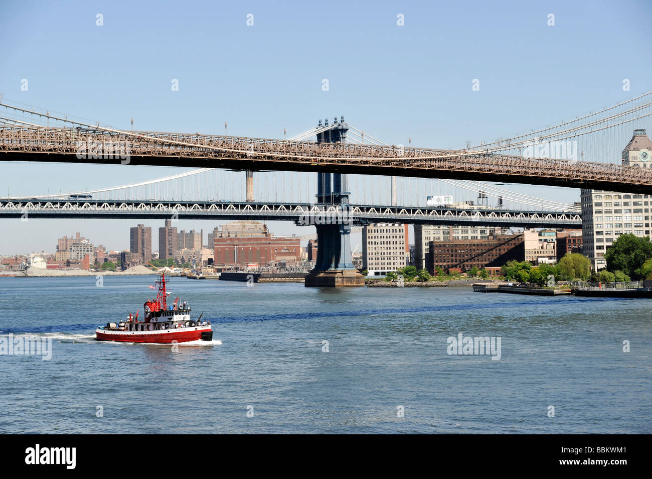 New York City Fireboat passing under the Brooklyn Bridge Brooklyn ...