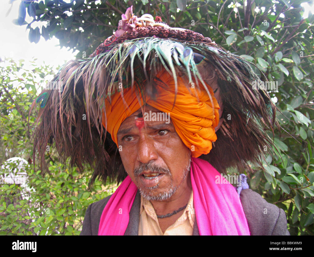 A traditional man with a grass hat on his turban Stock Photo - Alamy