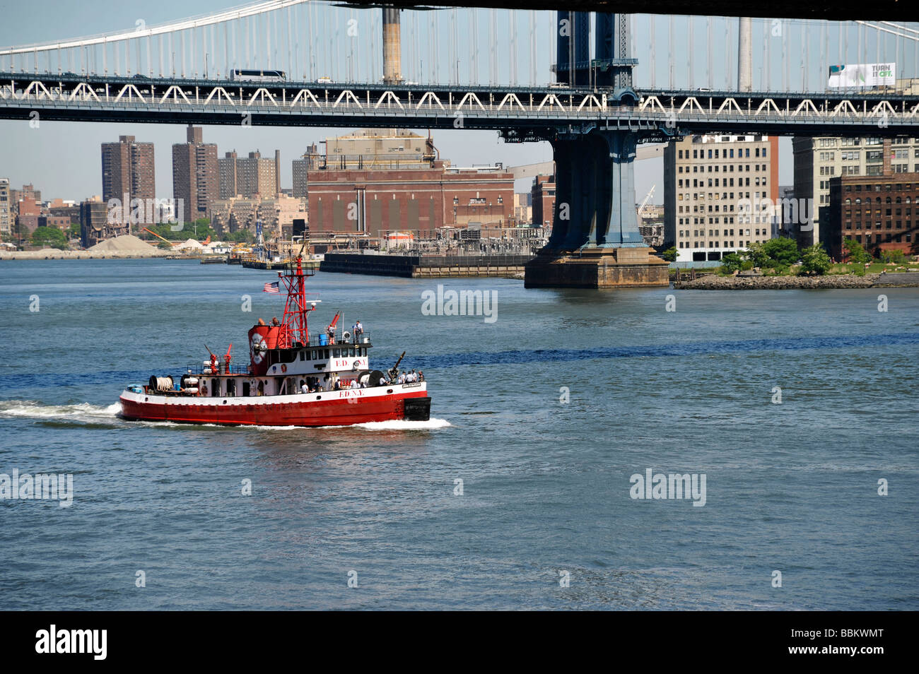 New York City Fireboat passing under the Brooklyn Bridge Brooklyn ...