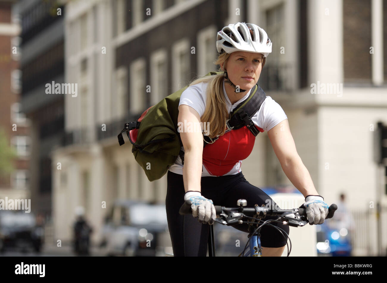 Young Woman Riding Bicycle to Work Stock Photo - Alamy