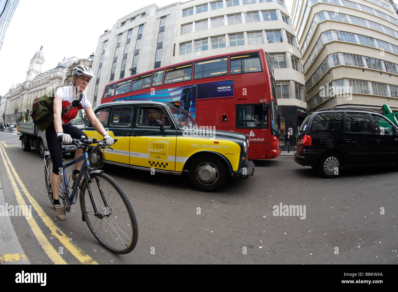 Woman bike bus taxi london hi-res stock photography and images - Alamy