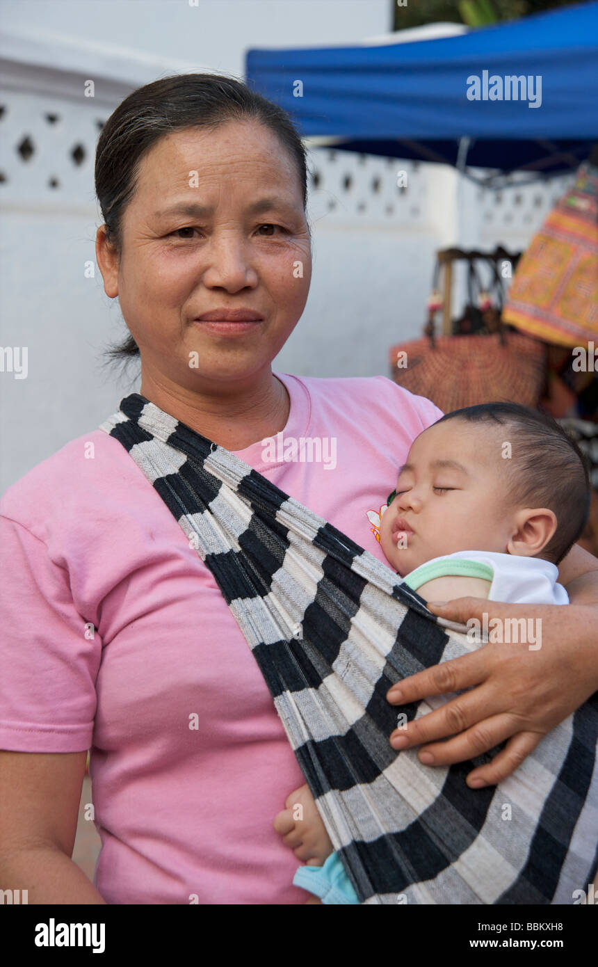 Market trader and her baby in the night market of Luang Prabang Laos ...