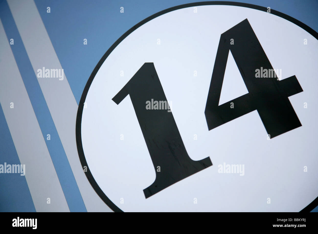 Number 14 in white circle on blue and grey background Stock Photo - Alamy