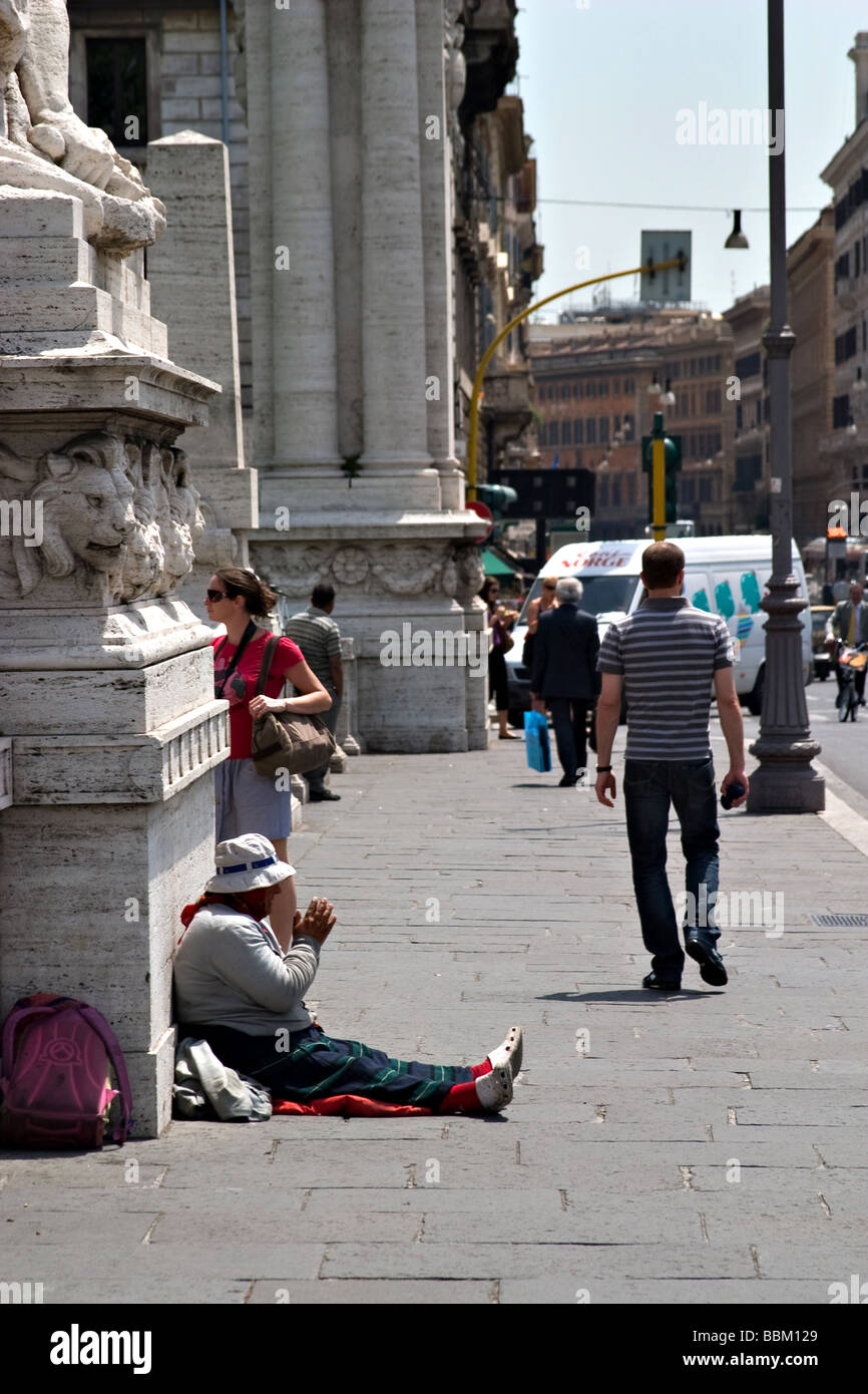Beggar on Bridge in Rome Stock Photo - Alamy
