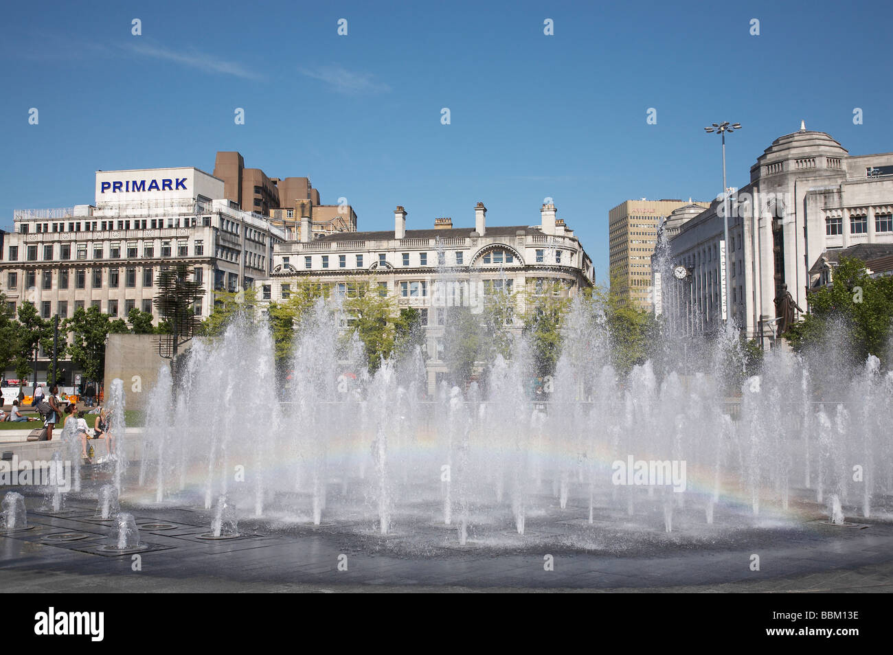 Fountain with rainbow in Manchester UK Stock Photo - Alamy