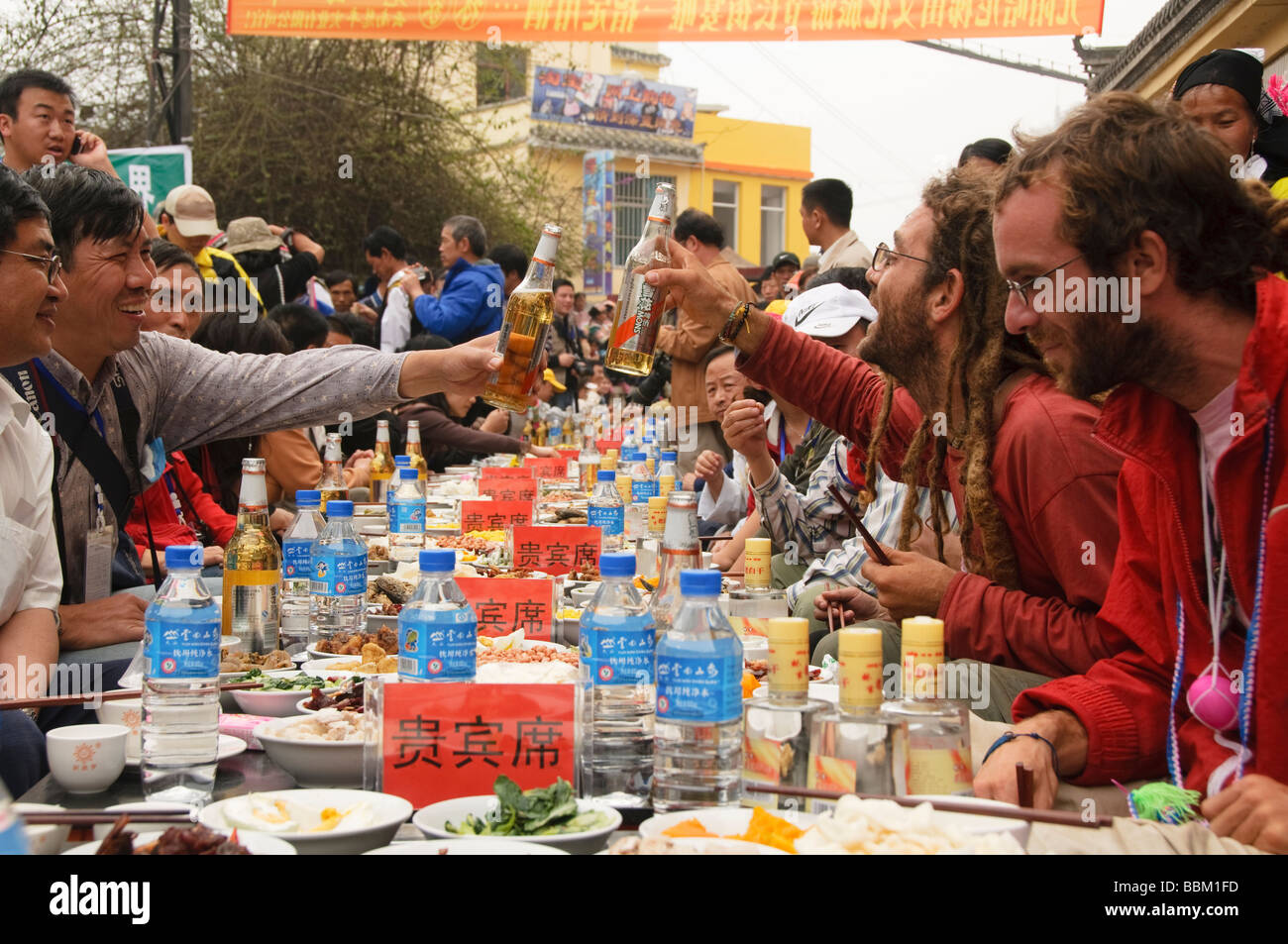 tourists and locals enjoying a toast at the Long Table Festival in ...