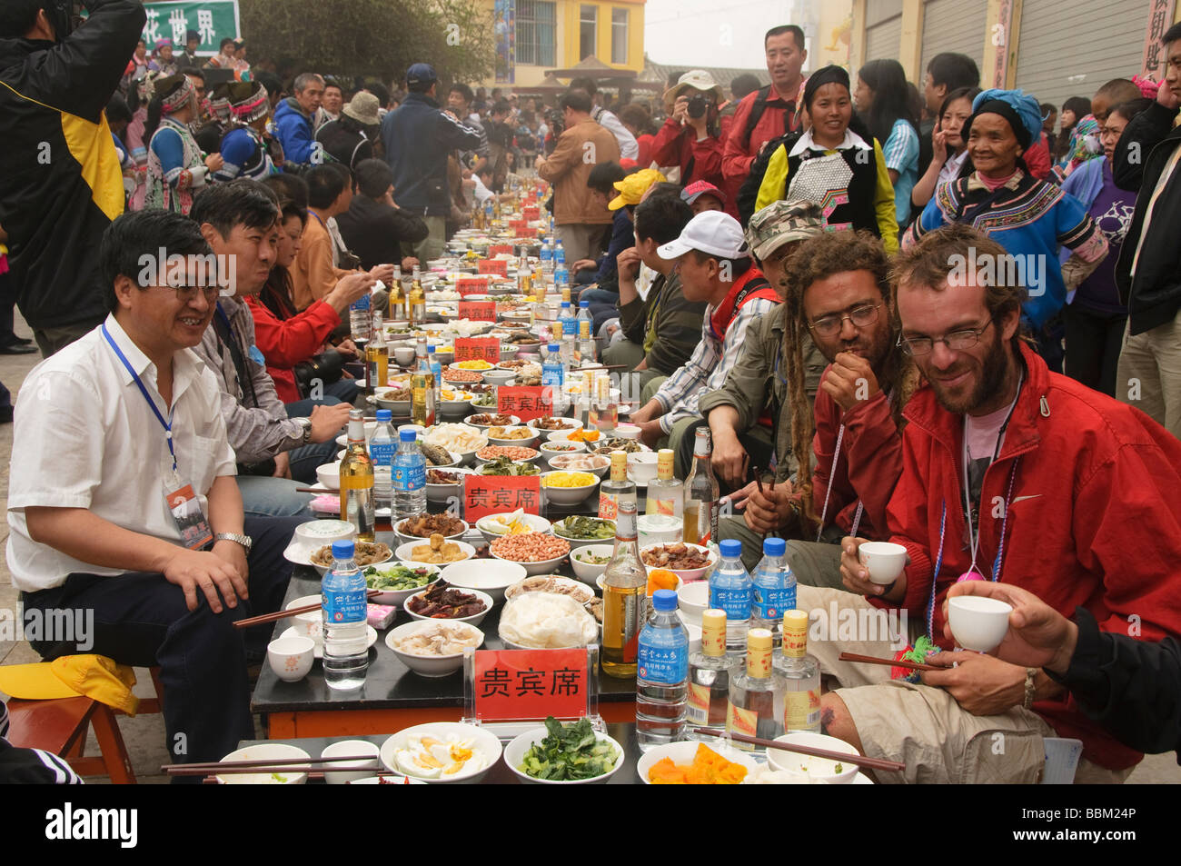 tourists and locals enjoying food at the Long Table Festival in ...