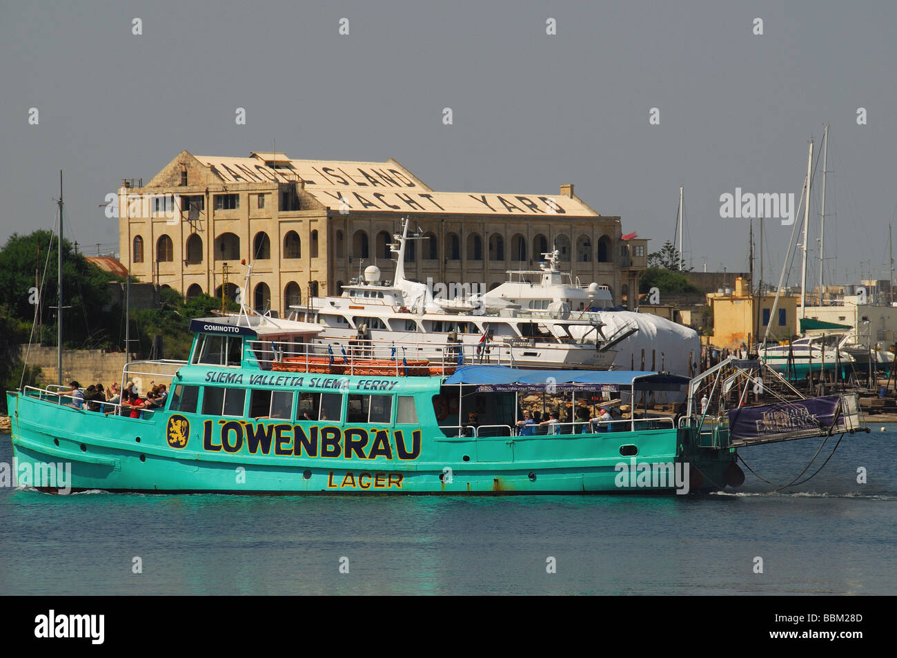 MALTA. The Sliema to Valletta passenger ferry passing Manoel Island on ...