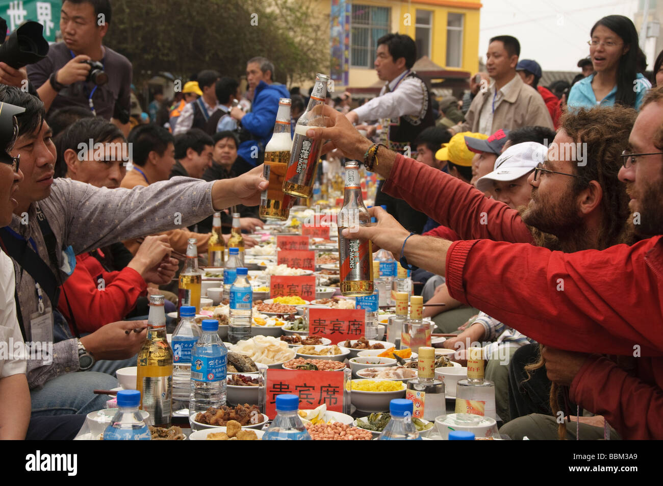tourists and locals enjoying a toast at the Long Table Festival in ...