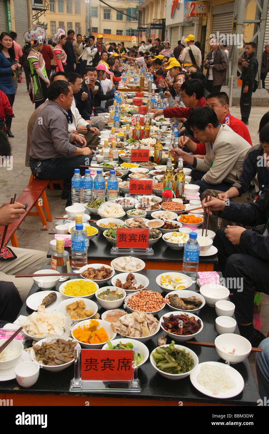 tourists and locals enjoying food at the Long Table Festival in ...