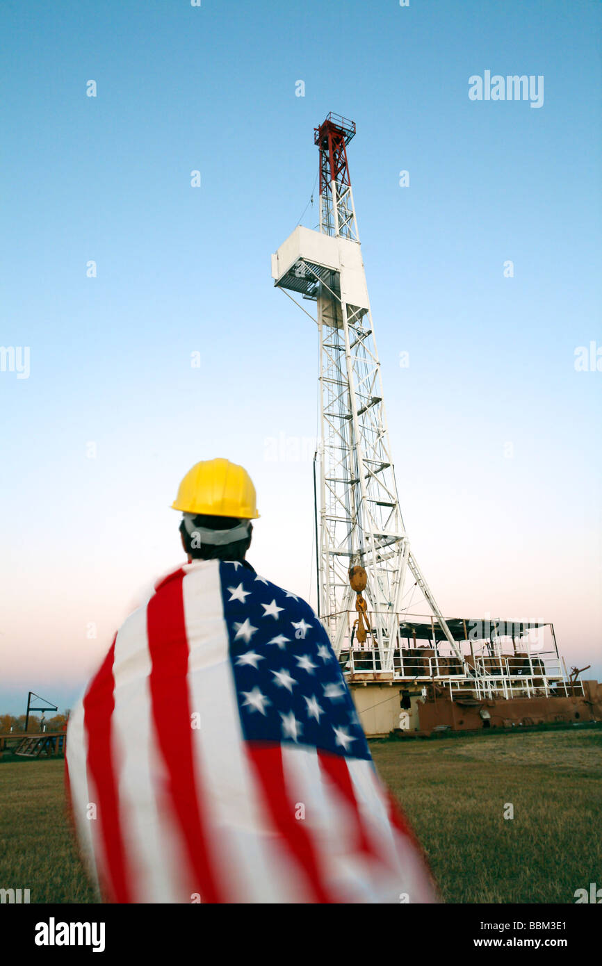 Oil industry worker wearing American flag at a drilling rig Stock Photo ...
