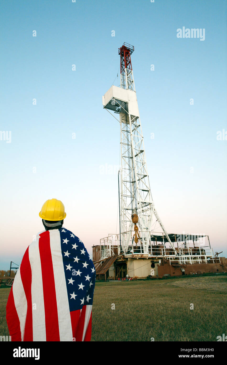 Oil industry worker wearing American flag at a drilling rig Stock Photo ...