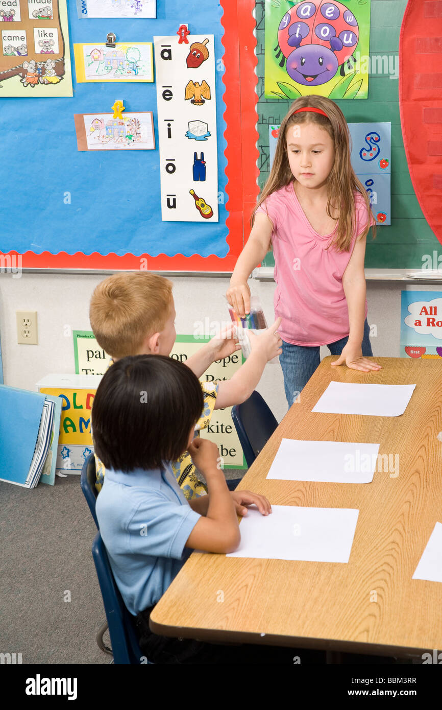 Child helping another child hi-res stock photography and images - Alamy