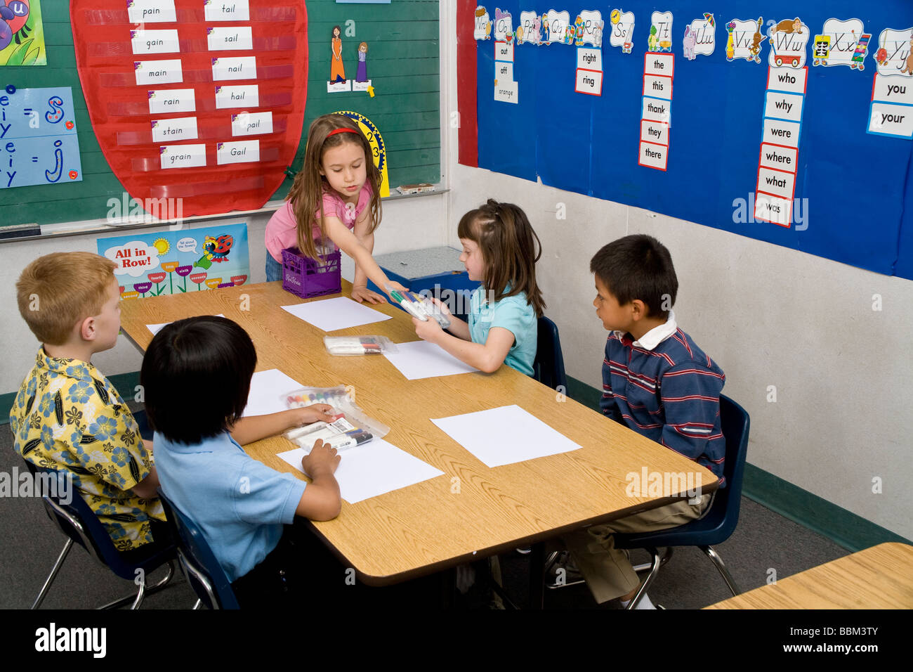 Child helping another child hi-res stock photography and images - Alamy