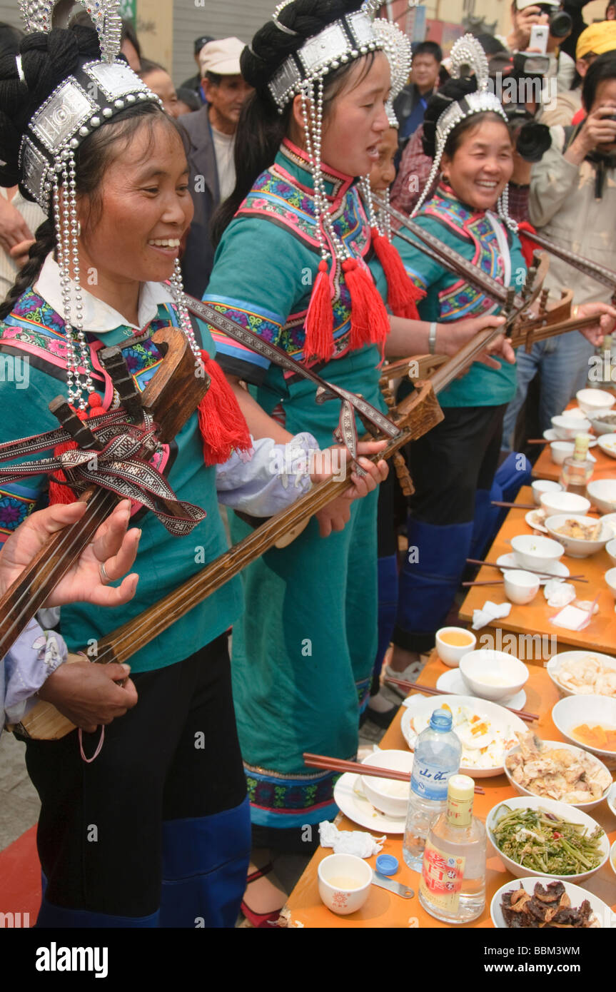 Hani women playing local instruments at the Long Table Festival in ...