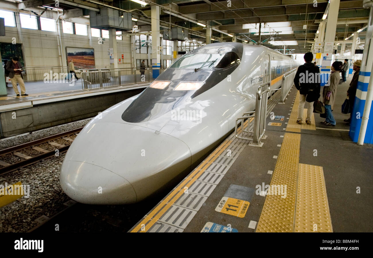 A shinkansen bullet train arrives at Hiroshima station Hiroshima ...