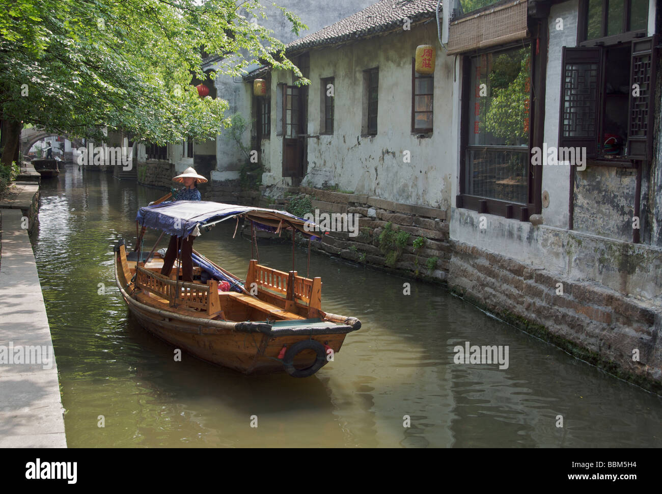 Canal rowing boat in the ancient water town of Zhouzhuang Jiangsu China ...