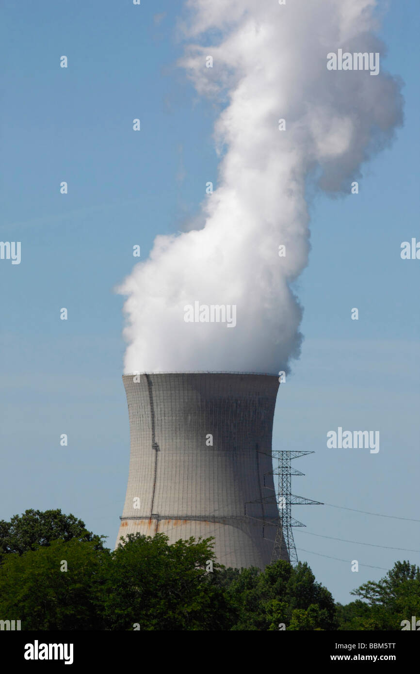 Chimney of a nuclear power plant station in the green nature on blue ...