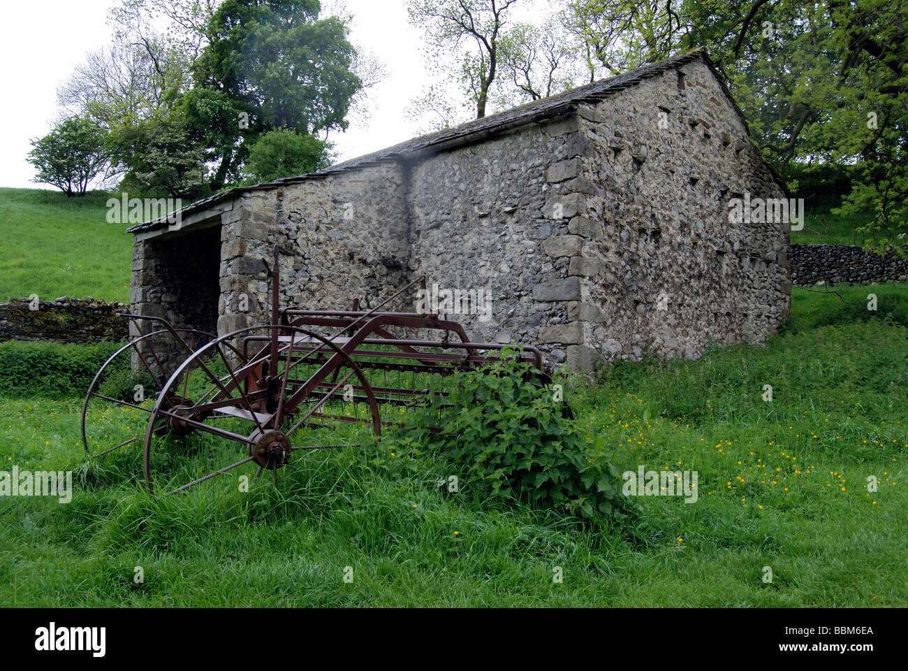 An old barn or farm building beside a footpath near Malham Village in ...