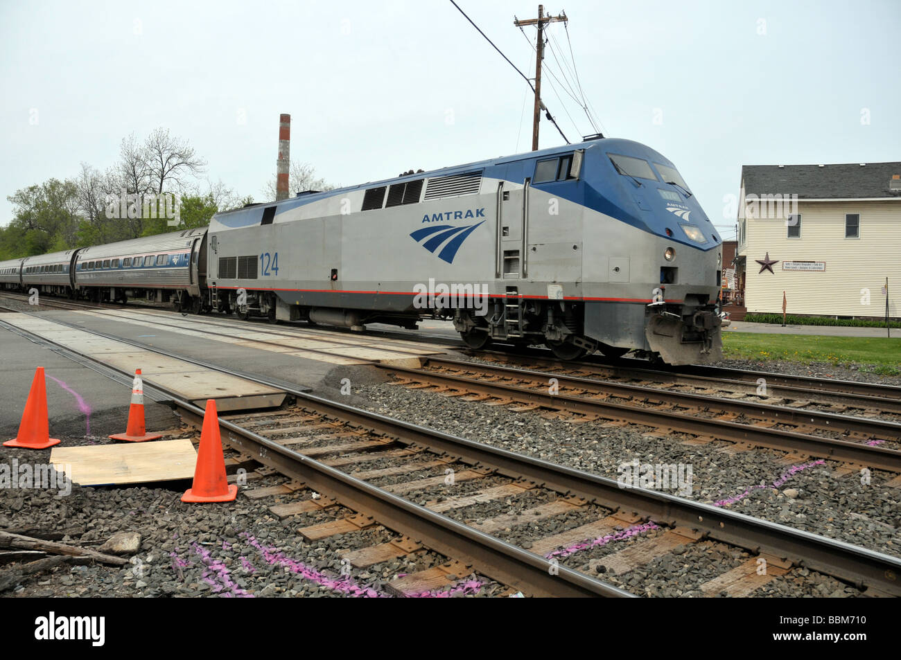 Amtrak train speeding through small town in USA Stock Photo - Alamy
