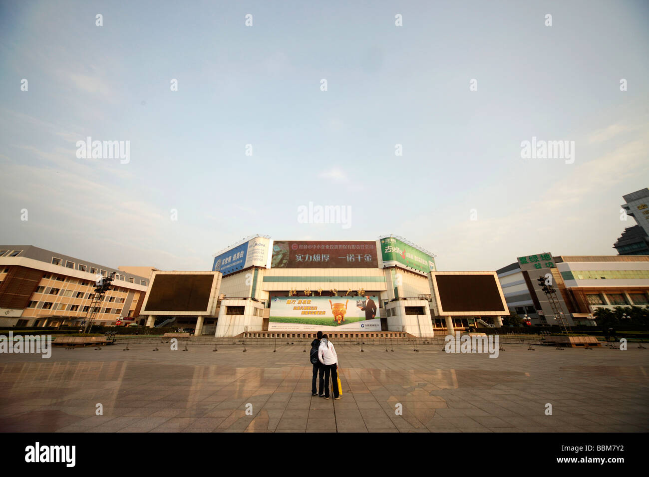 Lone pair on the huge central square in the Chinese city of Guilin ...